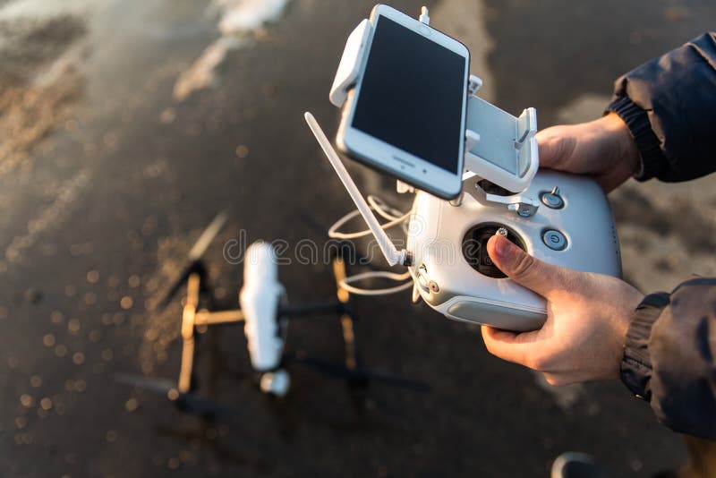 Man with Remote Control Prepare White Drone Digital Camera for Start ...