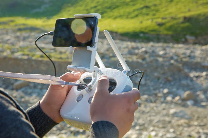 Man with Remote Control Prepare White Drone with Digital Camera for ...