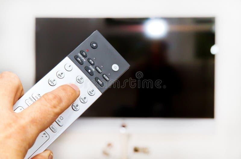 Man with a remote stock photo. Image of media, channel - 48216068