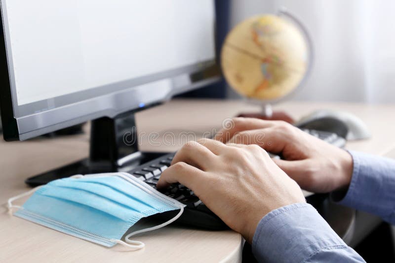 Man with Removed Protective Mask Typing at Sitting at PC Keyboard on ...