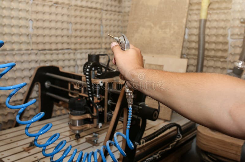 Man is Removing Dust from the Computer Numerical Control Machine for ...