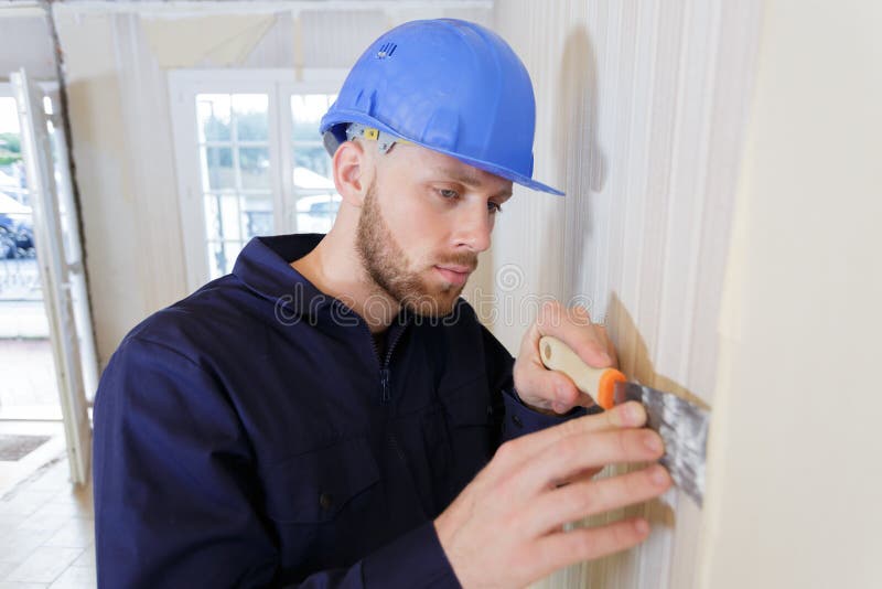 Man Removing Plaster from Wall Indoors Stock Photo - Image of house ...