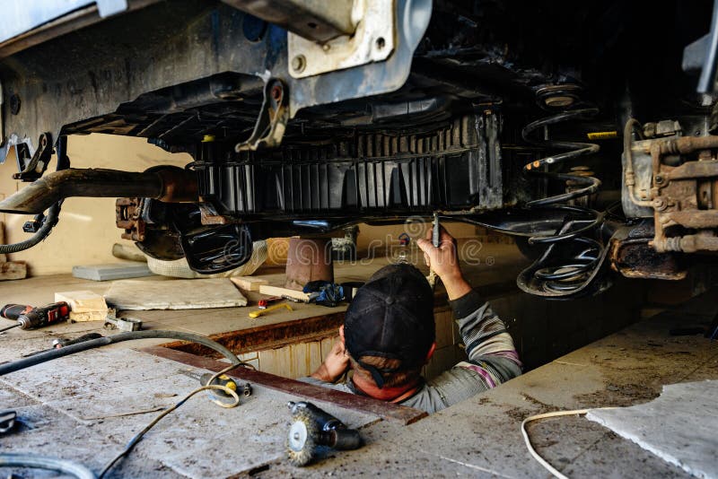Man Removing Rust from Car Parts. Car Body Corrosion. Stock Image ...