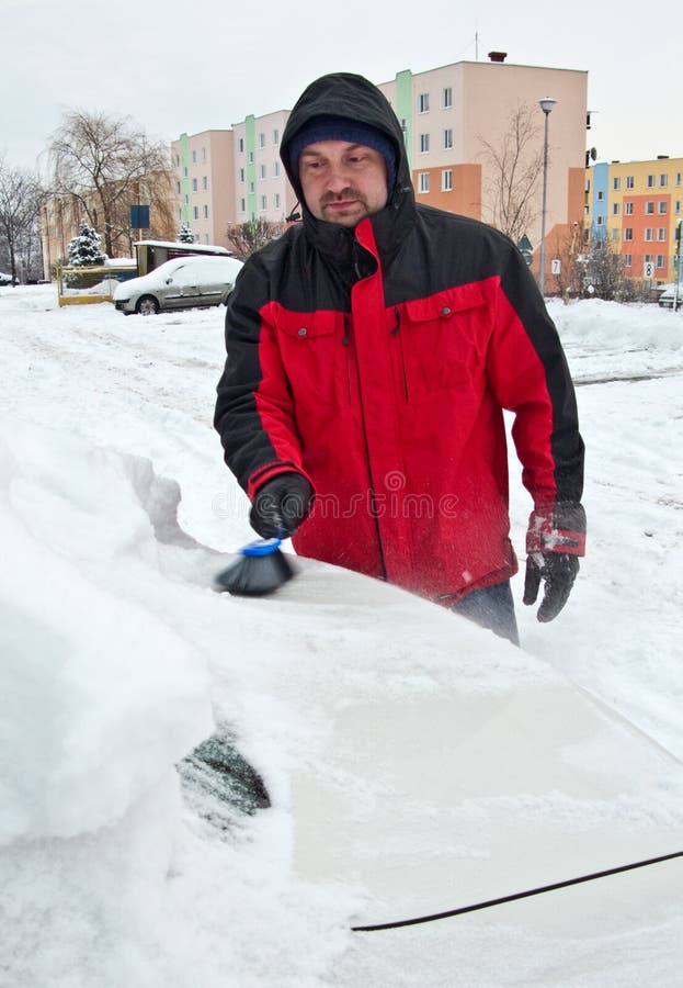 Man removing snow from car stock photo. Image of white - 12526104