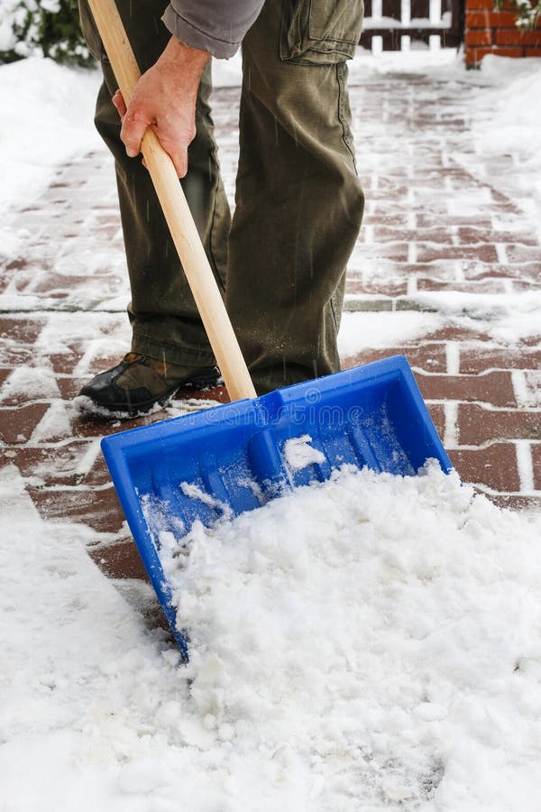 Man Removing Snow from the Sidewalk after Snowstorm Stock Photo - Image ...