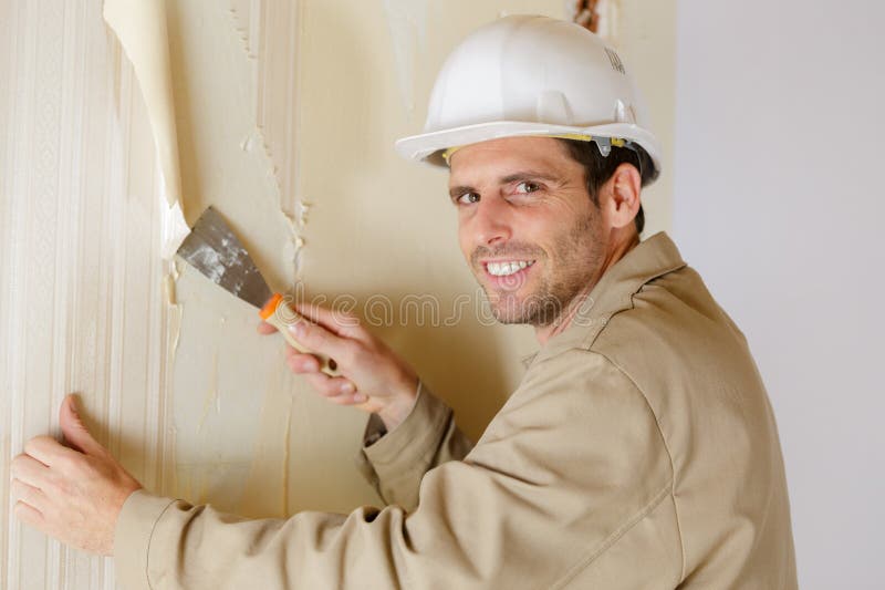 Man removing wallpaper stock image. Image of remove - 272482193