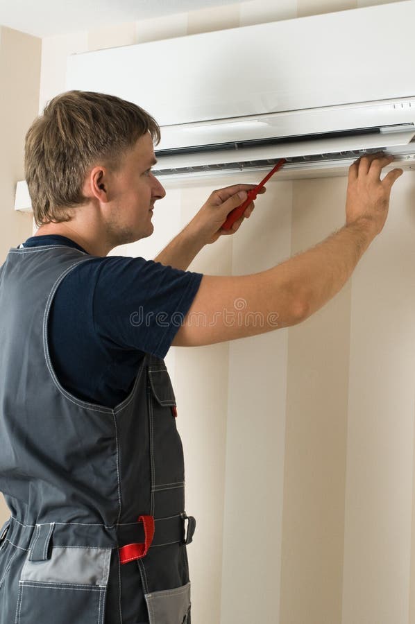 Man repair air-conditioner stock image. Image of person - 10438175