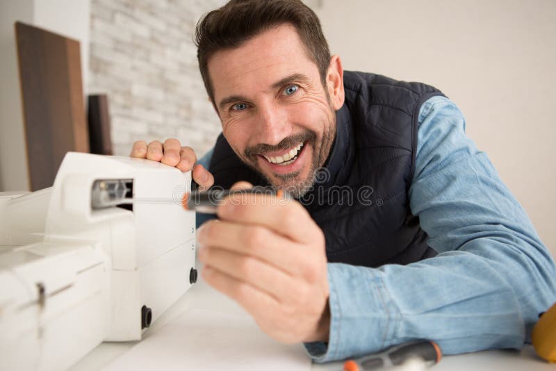 Man Repairer Fixing Sewing Machine Stock Image - Image of mechanic ...
