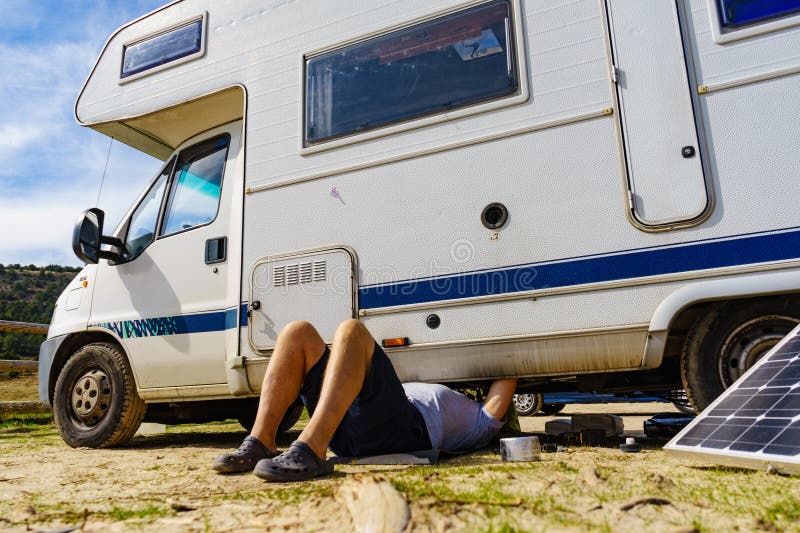 Man Repairing Bottom of the Rv Caravan Stock Photo - Image of work ...