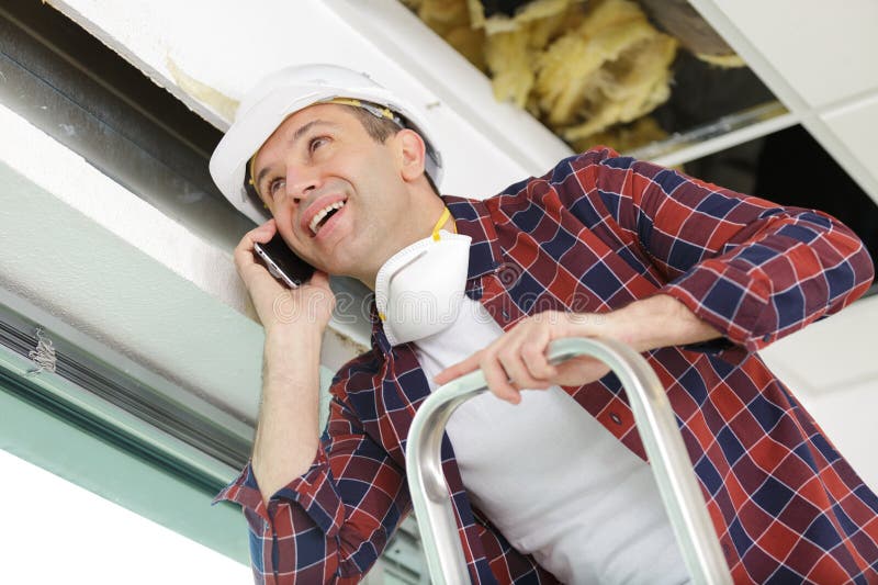 Man repairing ceiling stock photo. Image of hanging - 324570558
