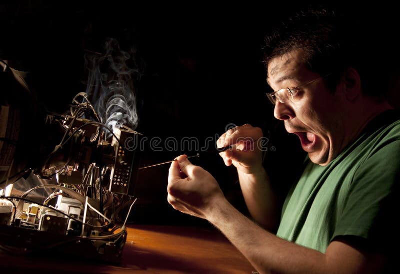 Man Repairing Computer on Fire Stock Image - Image of plug, fuse: 12884843