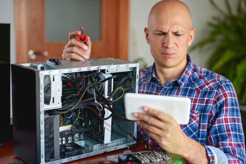Man repairing computer stock photo. Image of desk, motherboard - 179534652
