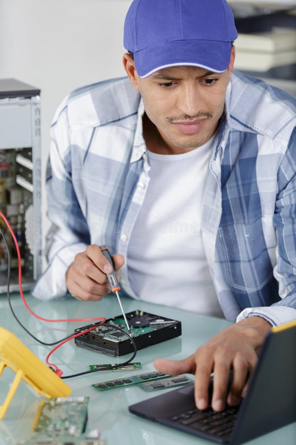 Man Repairing Computer Part in Service Center Stock Image - Image of ...
