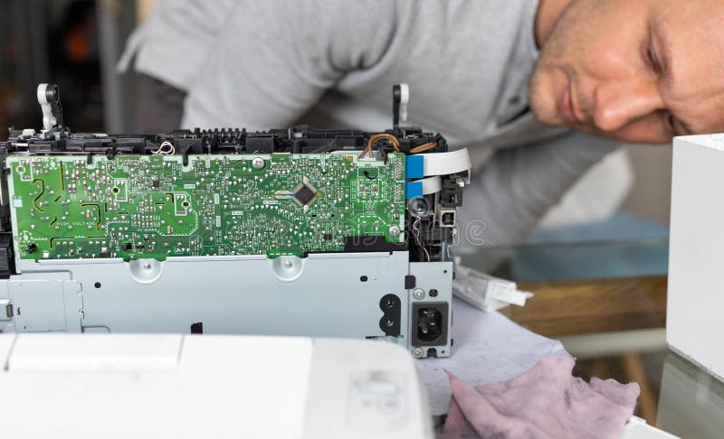 Man Repairing Computer Part in Service Center. Repairing and Fixing ...