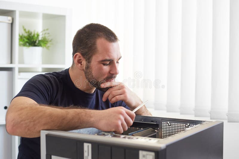 Man repairing computer stock photo. Image of portrait - 67521816