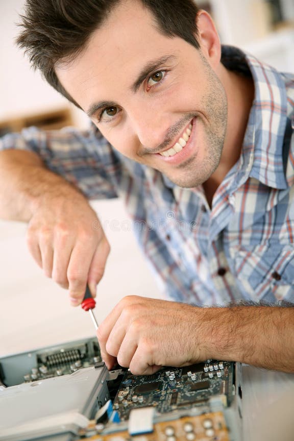 Man Repairing Computer with Screwdriver Stock Photo - Image of worker ...