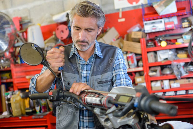 Man Repairing Custom Motorbike Stock Image - Image of bending, person ...