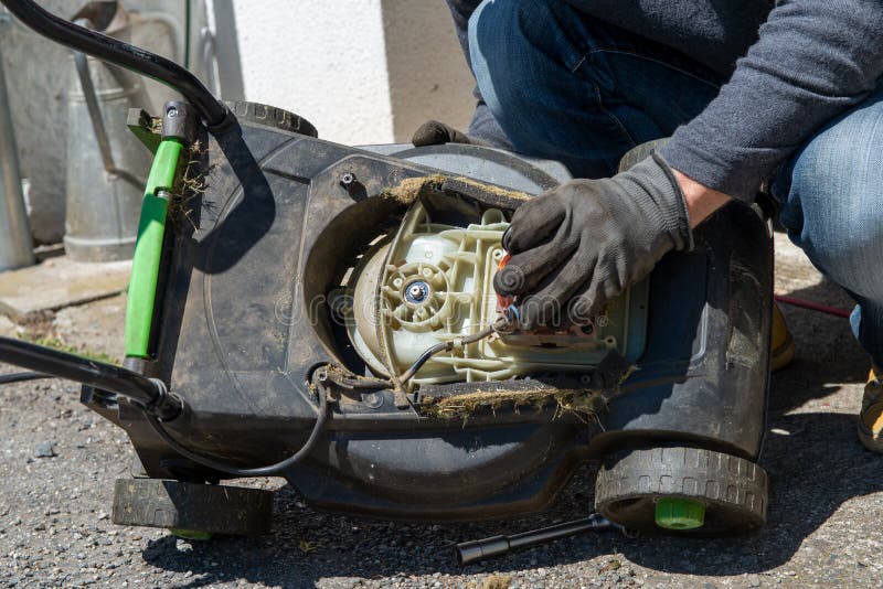 Man Repairing an Electric Lawn Mower Stock Image - Image of mechanic ...