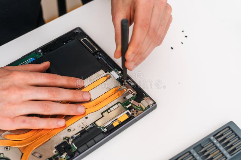 Man Repairing an Modern Laptop Device with Screwdriver Tool Stock Photo ...