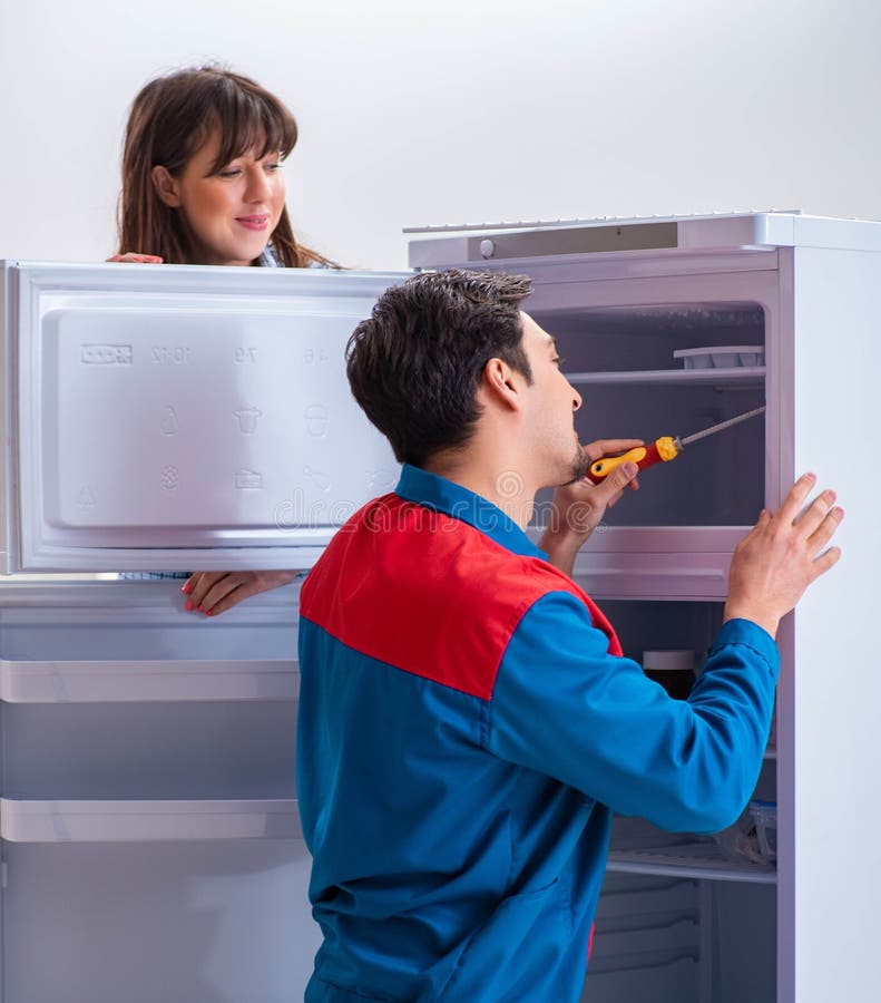 Man Repairing Fridge with Customer Stock Image - Image of fixing ...