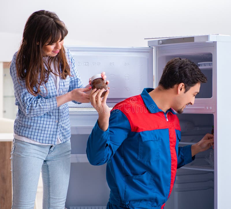 Man Repairing Fridge with Customer Stock Image - Image of male ...