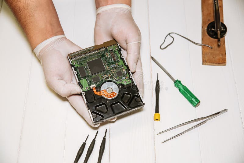 Man Repairing Hard Disk. Inside Details of the Old Personal Computer ...