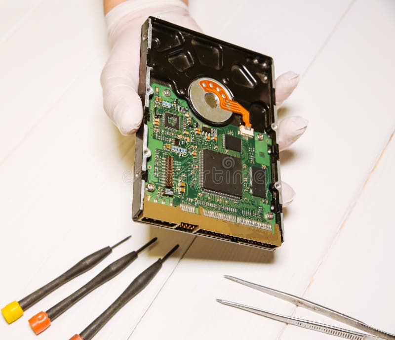 Man Repairing Hard Disk. Inside Details of the Old Personal Computer ...