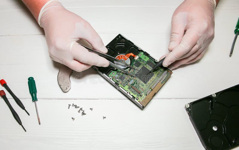 Man Repairing Hard Disk. Inside Details of the Old Personal Computer ...