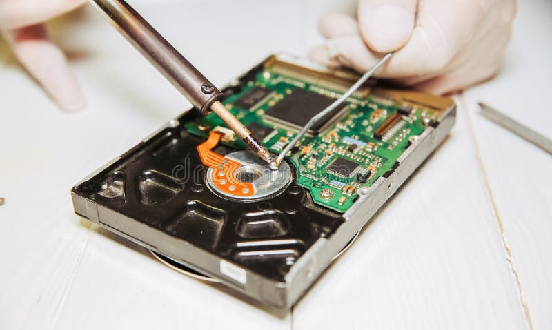 Man Repairing Hard Disk. Inside Details of the Old Personal Computer ...