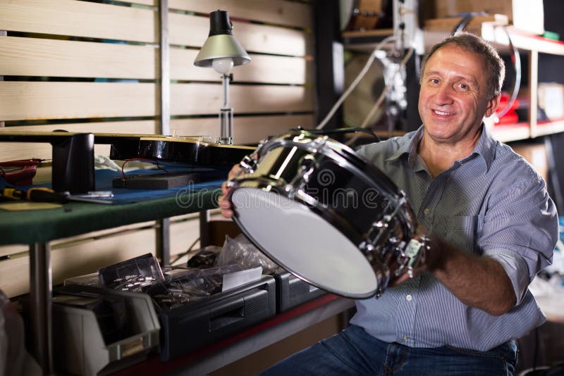 Man is Repairing Instruments Stock Photo - Image of light, hobby: 205961450