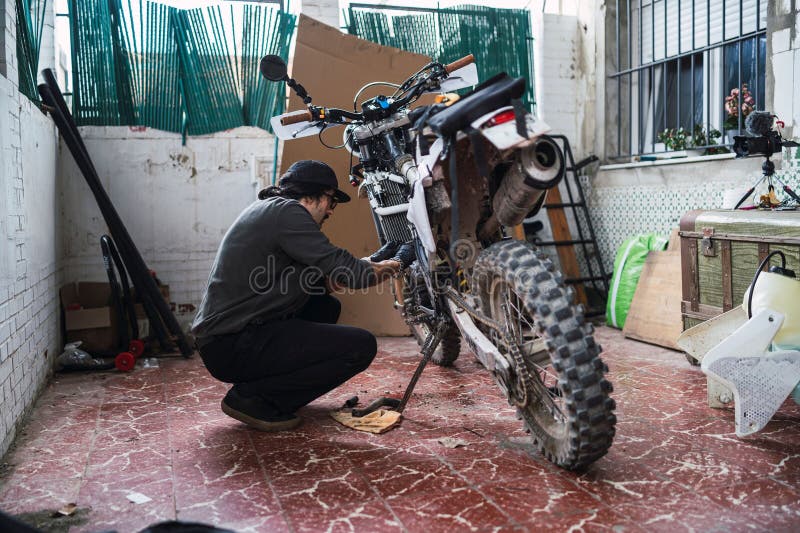 Man Repairing Motorcycle in Garage Stock Photo - Image of fixing ...
