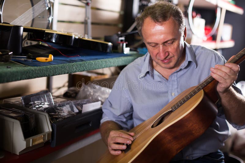 Man is Repairing Musical Instruments Stock Photo - Image of classic ...