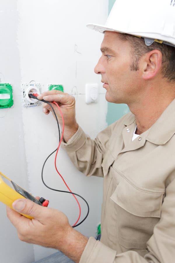 Man repairing socket stock photo. Image of control, industry - 197178458