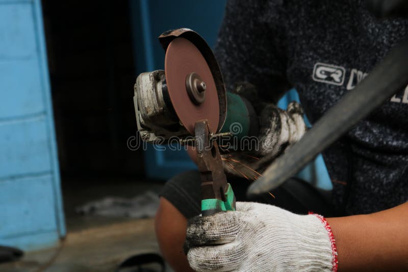 A Man is Repairing Something at the Workshop Stock Image - Image of ...