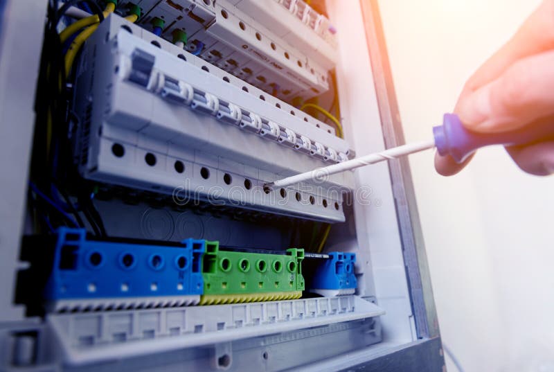 The Man is Repairing the Switchboard Voltage with Automatic Switches ...