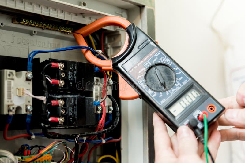 The Man is Repairing the Switchboard Voltage with Automatic Switches ...