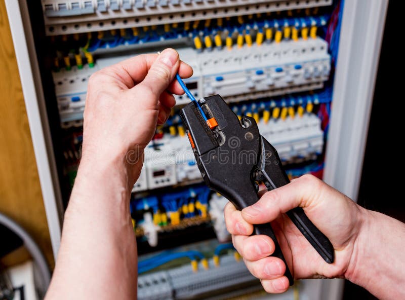 The Man is Repairing the Switchboard Voltage with Automatic Switches ...