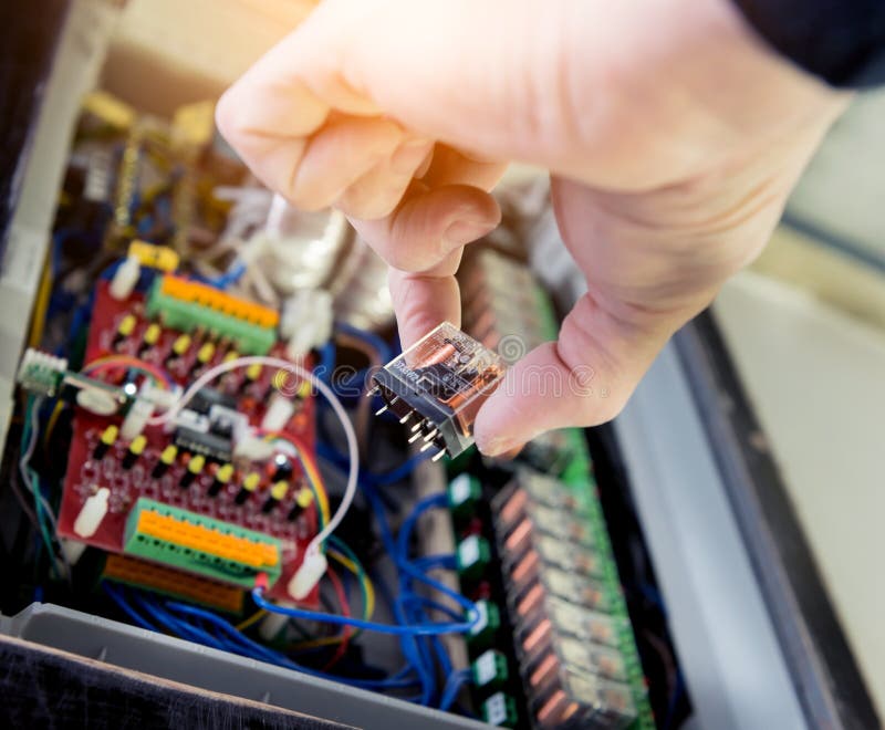 The Man is Repairing the Switchboard Voltage with Automatic Switches ...