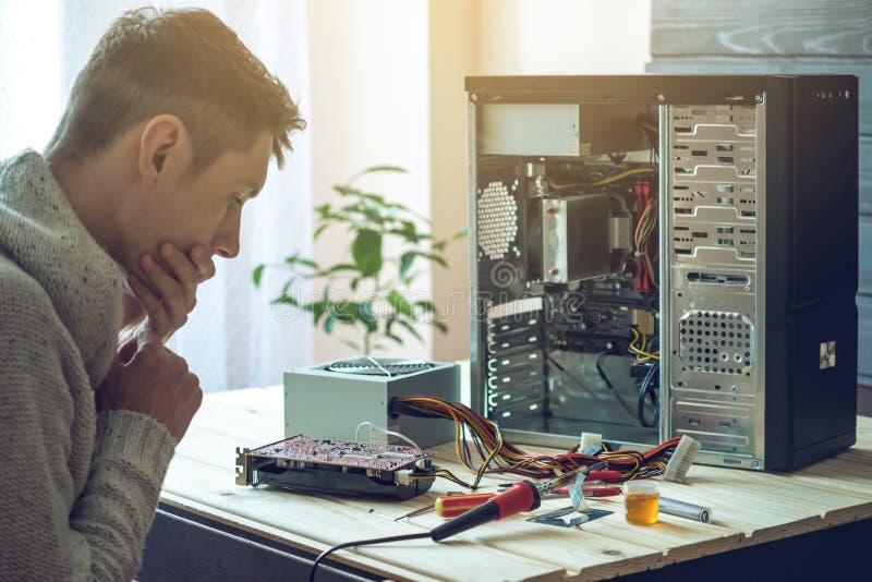Man Repairman is Trying To Fix Using the Tools on the Computer that is ...