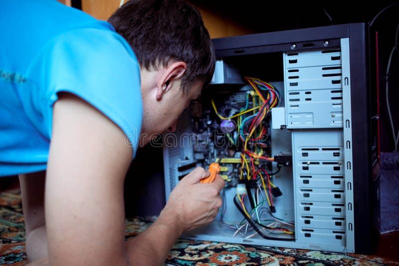 Man repairs the computer stock photo. Image of caucasian - 58914060