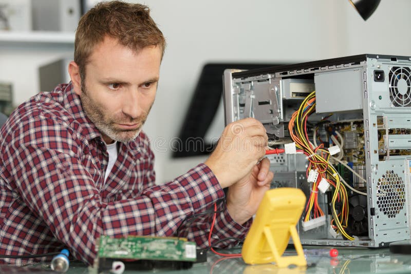 Man repairs a pc stock photo. Image of order, technology - 264198970