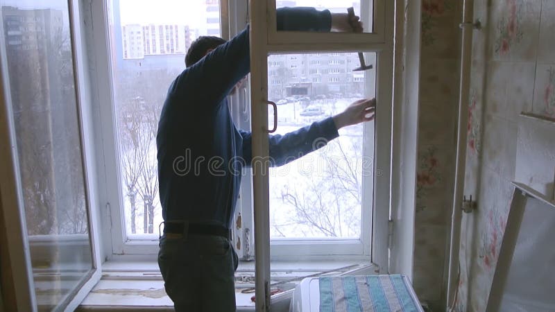 Man Repairs Wood Window. Replace Broken Glass on Window Stock Footage ...