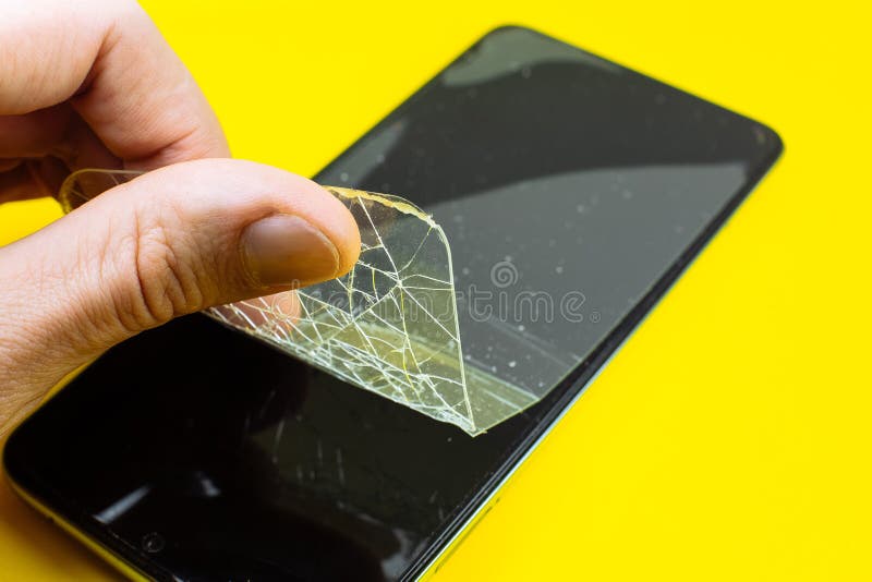 Man Replacing the Broken Tempered Glass Screen Protector. Crashed ...