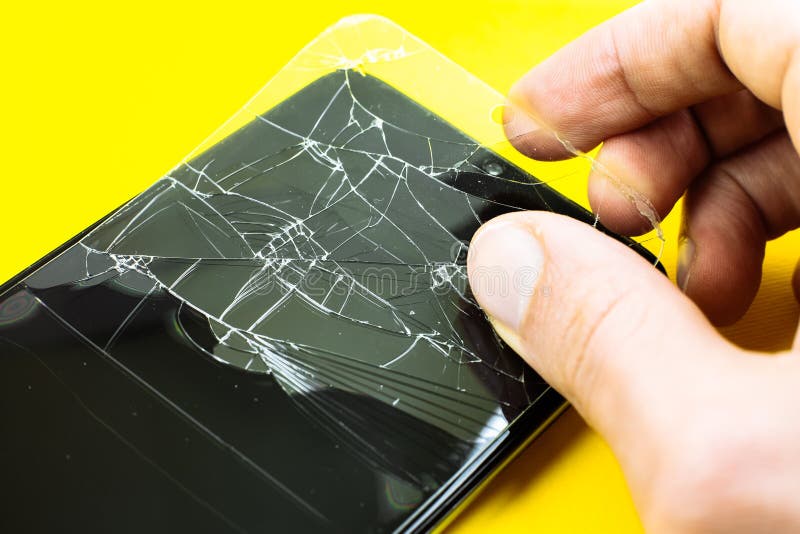 Man Replacing the Broken Tempered Glass Screen Protector. Crashed ...