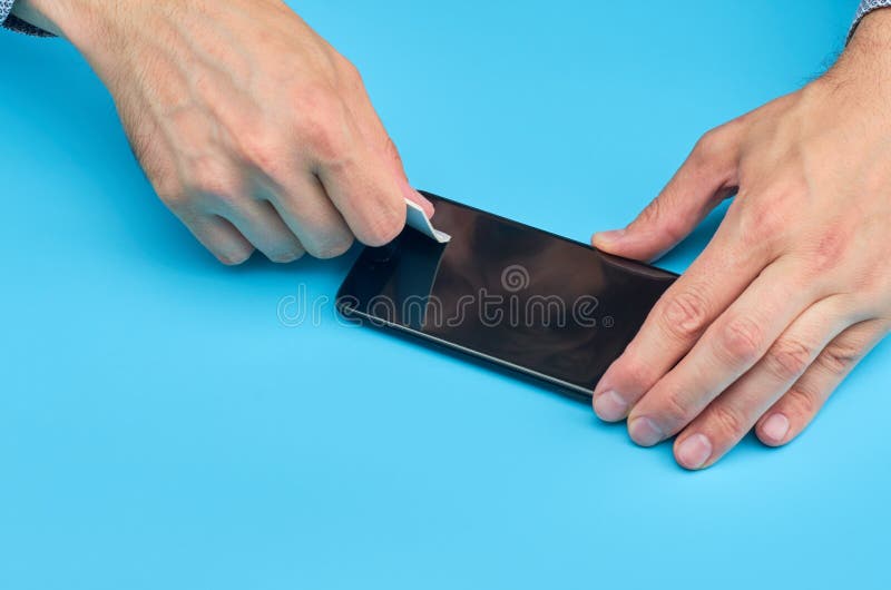 The Man Replacing the Broken Tempered Glass Screen Protector for ...