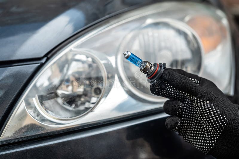 Man Replacing a H7 Halogen Burnt Out Lamp in Auto Headlight Stock Image ...