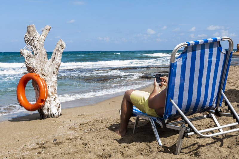 Man rest on the beach stock image. Image of pleasure - 145484121