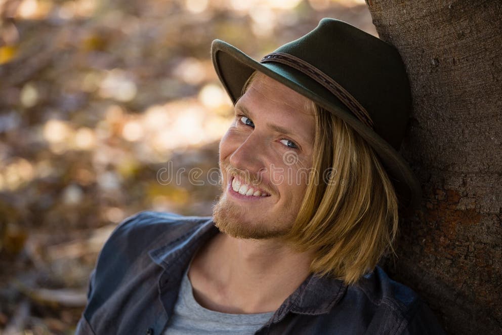 Man Resting Against a Tree in the Park Stock Photo - Image of people ...