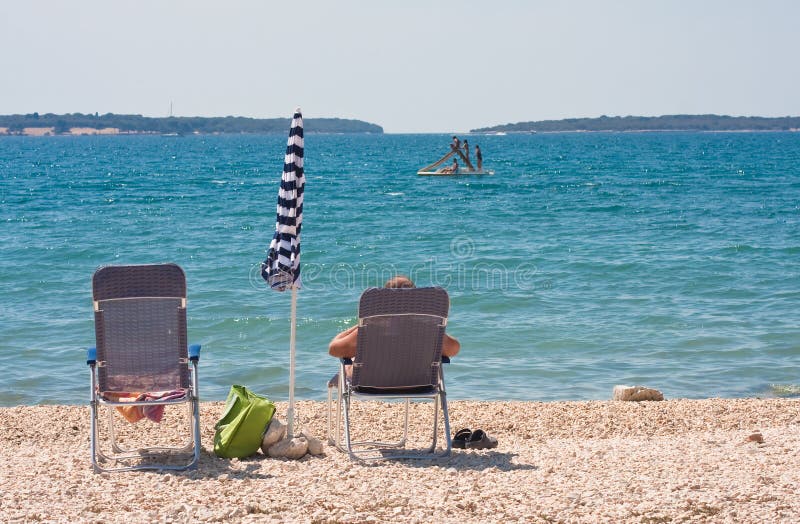 Man resting on the beach stock image. Image of vacation - 26380137