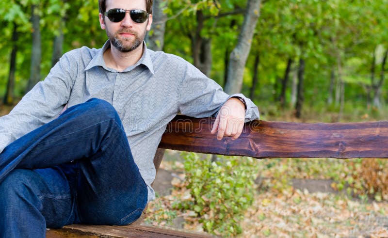 Man resting on a bench stock photo. Image of alone, expression - 27823298